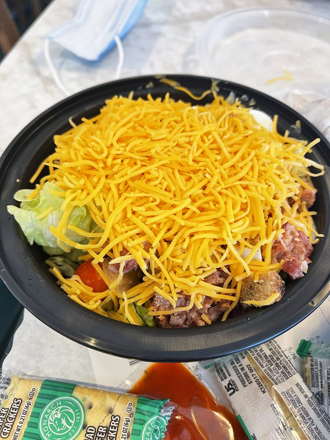 A salad so generously topped with cheese, it blurs the line between healthy choice and delicious indulgence—Burky's understands balance.