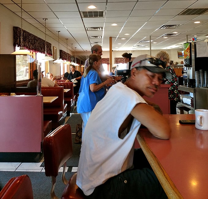 The bustling dining room captures that special diner energy where strangers become friends over shared love of good food.
