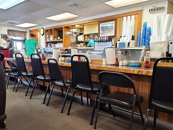 The counter seating—where regulars perch like birds on a wire, watching the kitchen ballet while trading stories and waiting for their plates of perfection.