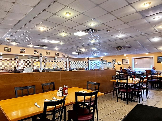 Classic diner seating arranged with the precision of a chess master—each table its own little island of potential culinary happiness.
