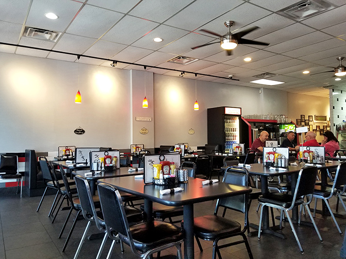 The dining area's simple, clean design with pendant lighting creates that perfect neighborhood café vibe where conversations flow as easily as the coffee.