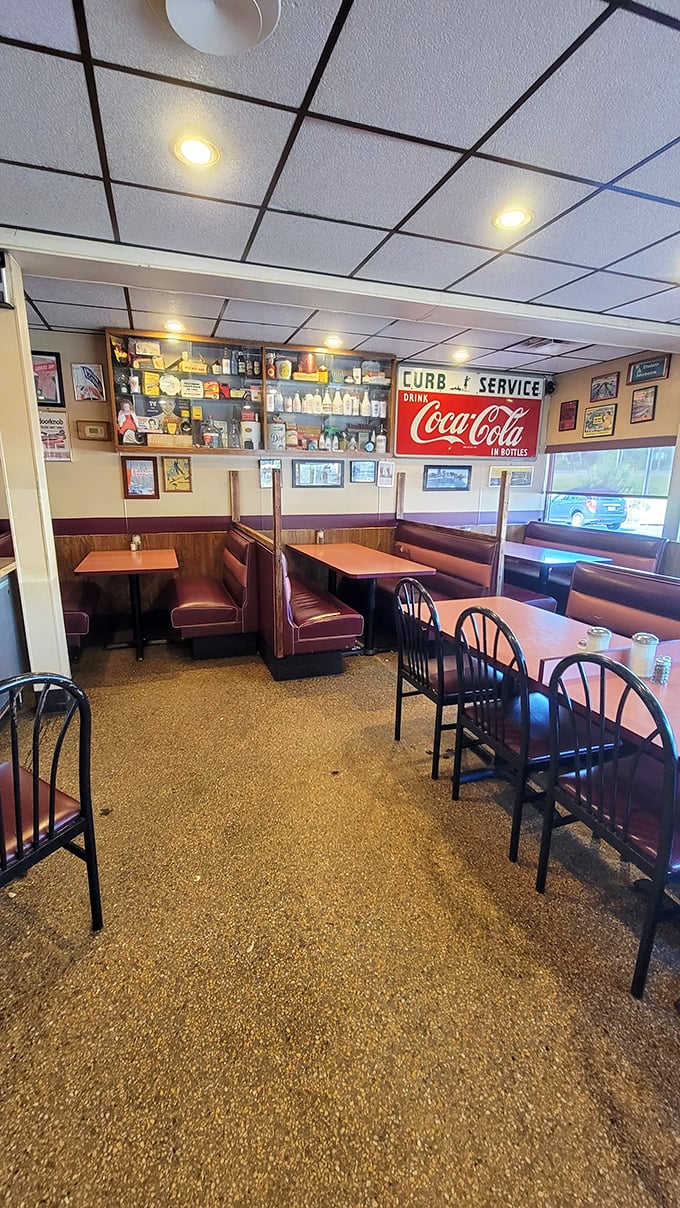 A dining room where time stands still. That vintage Coca-Cola sign isn't retro décor—it's been there since "retro" was just called "new."