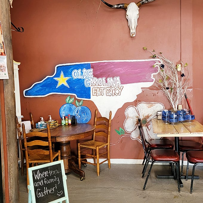 The hand-painted North Carolina silhouette mural says it all: "Where friends and family gather" isn't just a slogan here, it's the daily special.