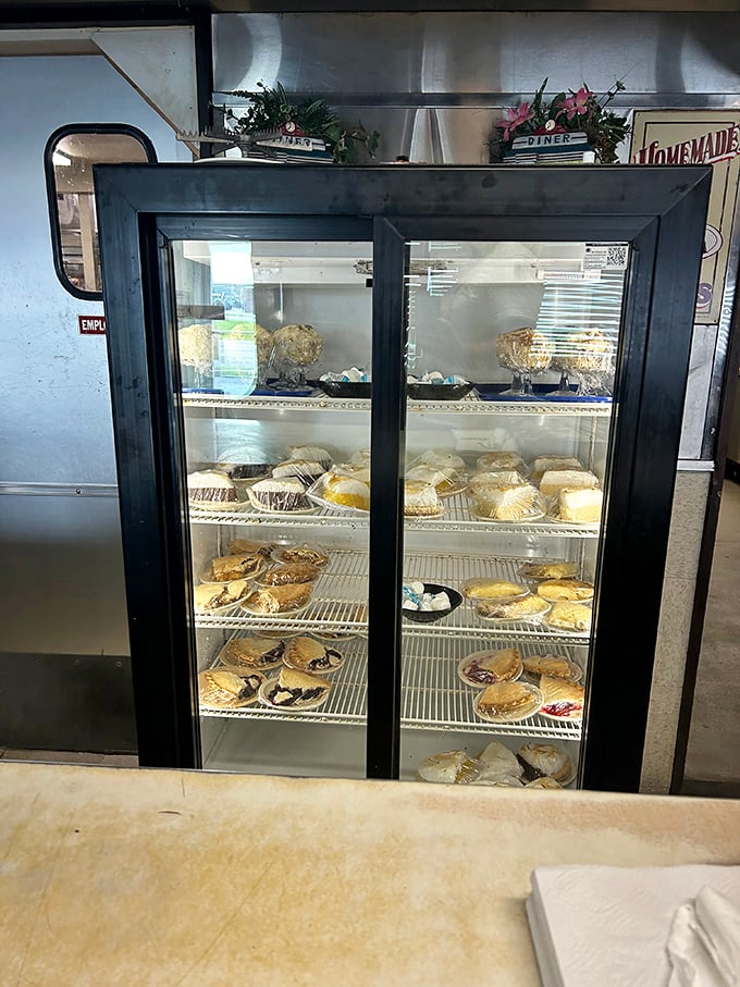 The dessert case—where willpower goes to die. Those homemade pies are practically winking at you from behind the glass.