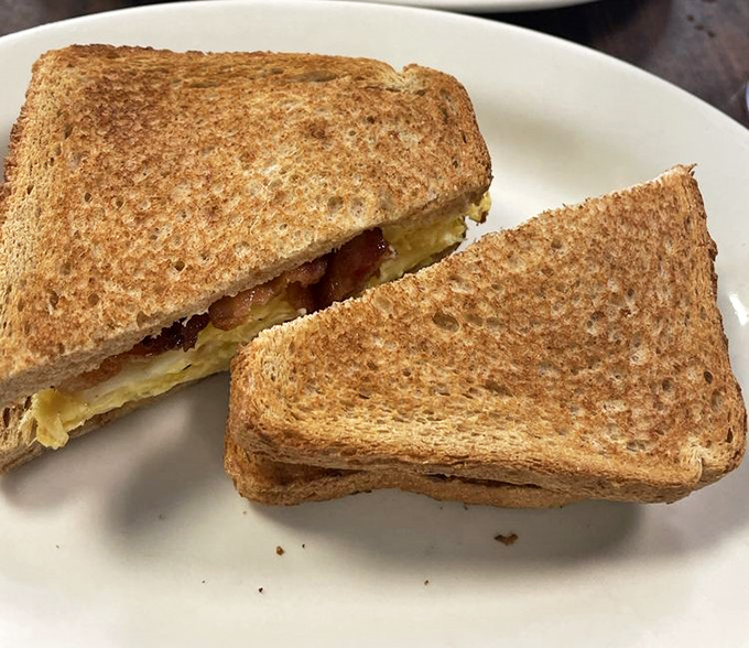 The breakfast sandwich that launched a thousand satisfied sighs. Perfectly toasted bread holding the morning's most important ingredients.