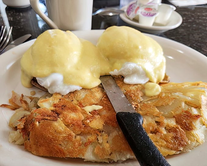 Eggs Benedict with hollandaise that flows like liquid gold—proof that classics become classics for very good reasons.