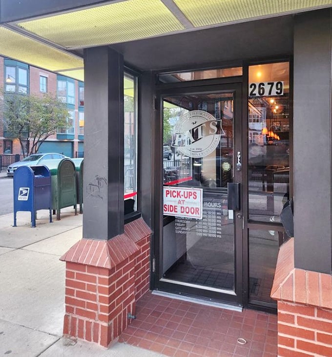 The entrance at 2679 N. Lincoln announces itself without fanfare – just a straightforward door promising honest food and zero culinary gimmicks inside.