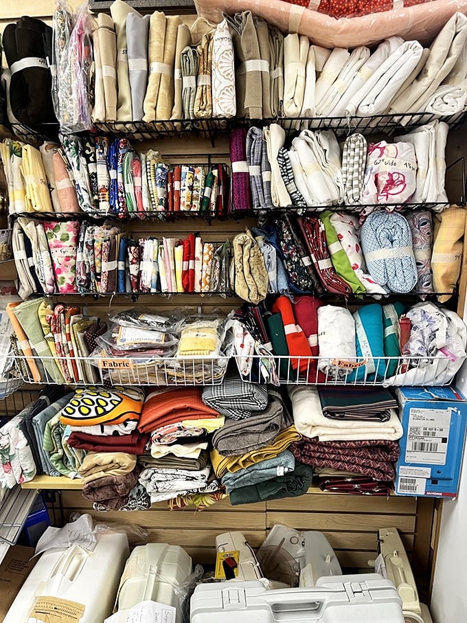 Fabric treasures stacked high, waiting to become your next quilting project or reupholstery adventure.