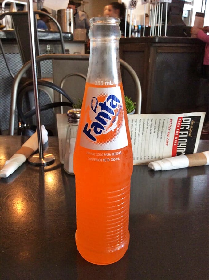 Nothing says "vacation mode" quite like a bright orange Fanta alongside your barbecue—a nostalgic sip that brings out your inner kid.