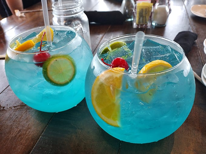 These fishbowl cocktails in electric blue aren't just drinks, they're vacation in a glass – complete with enough fruit to count as a vitamin supplement.