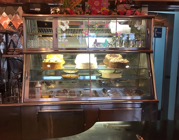 The dessert case—where willpower goes to die. Those cakes and pies aren't just desserts; they're edible monuments to American baking tradition.
