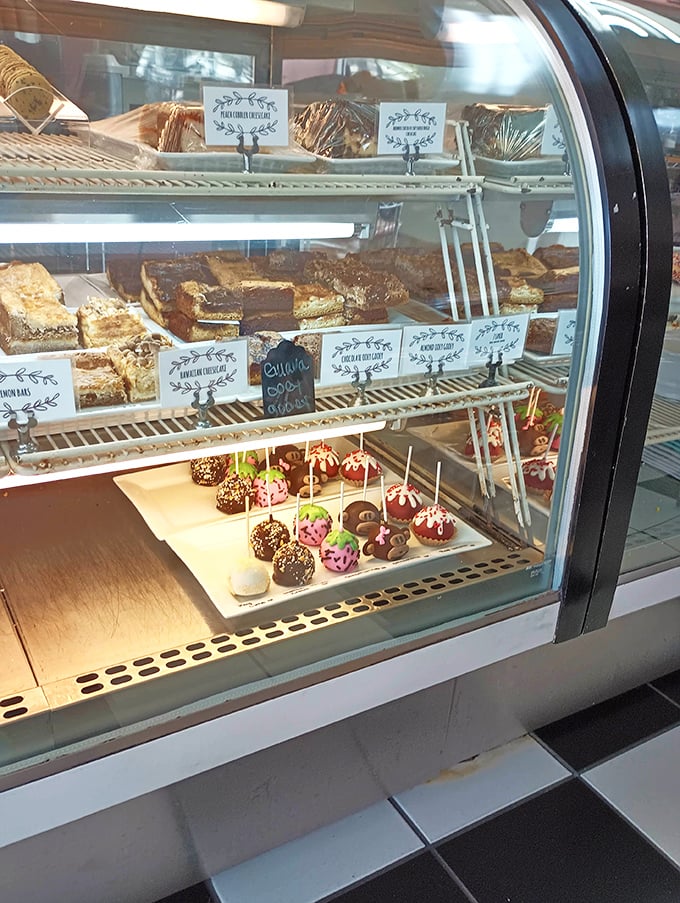 The display case—where dreams are stacked on shelves and calories don't count if you eat them standing up.