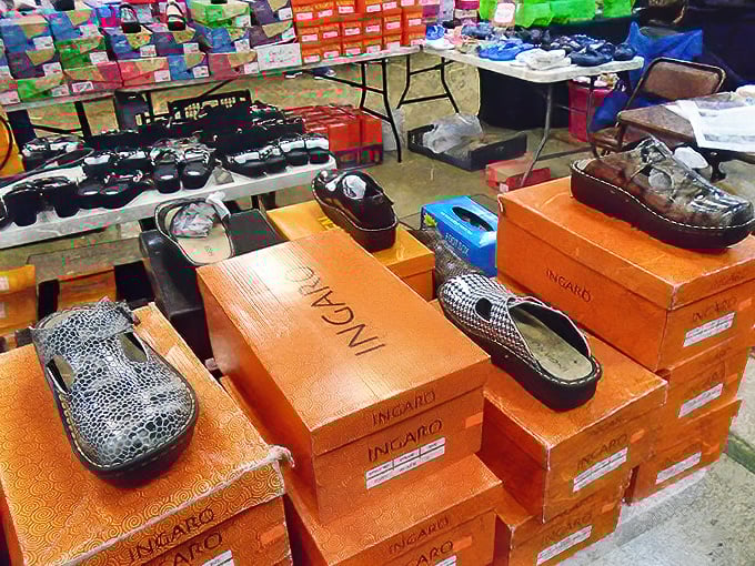 Shoe boxes stacked like a fashionista's dream. These aren't just footwear—they're future adventures waiting to be walked into at bargain prices.