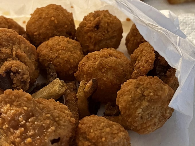 These aren't your average mushrooms—they're little flavor bombs, breaded and fried to that perfect golden moment between crisp and tender.