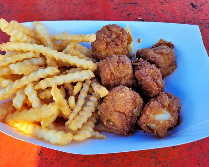 Fried scallops and crinkle-cut fries – the golden duo that makes diets disappear faster than the tide. Worth every calorie.
