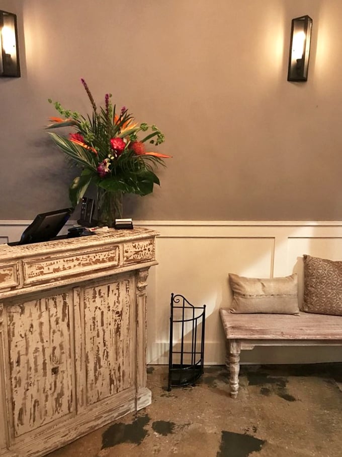 The host station welcomes you with distressed elegance and fresh flowers—like your stylish friend who makes everything look effortless.