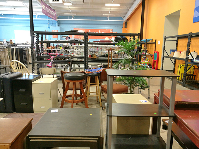 Office furniture mingles with barstools and shelving in the furniture department—a grown-up version of musical chairs where everything costs less than your monthly coffee budget.