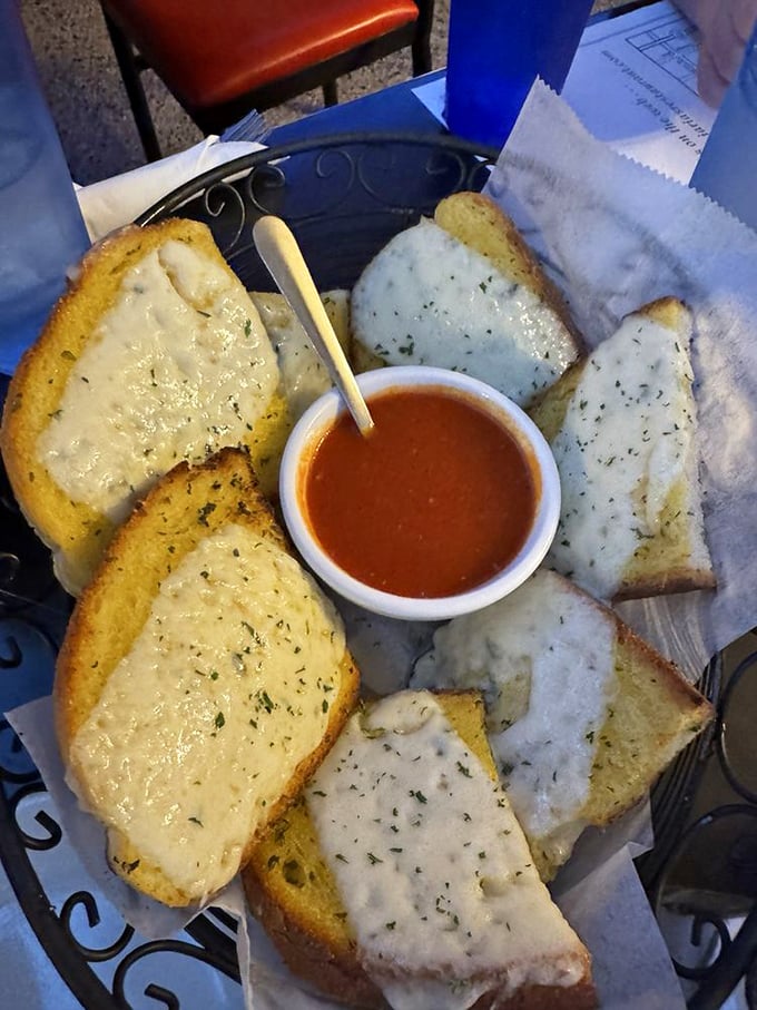 Garlic cheese bread arranged in a perfect circle, like a carb-loaded clock counting down to delicious satisfaction.