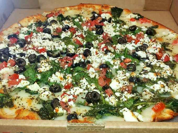 Mediterranean meets Midwest in this Greek pizza masterpiece—a cultural collaboration that deserves its own peace treaty.
