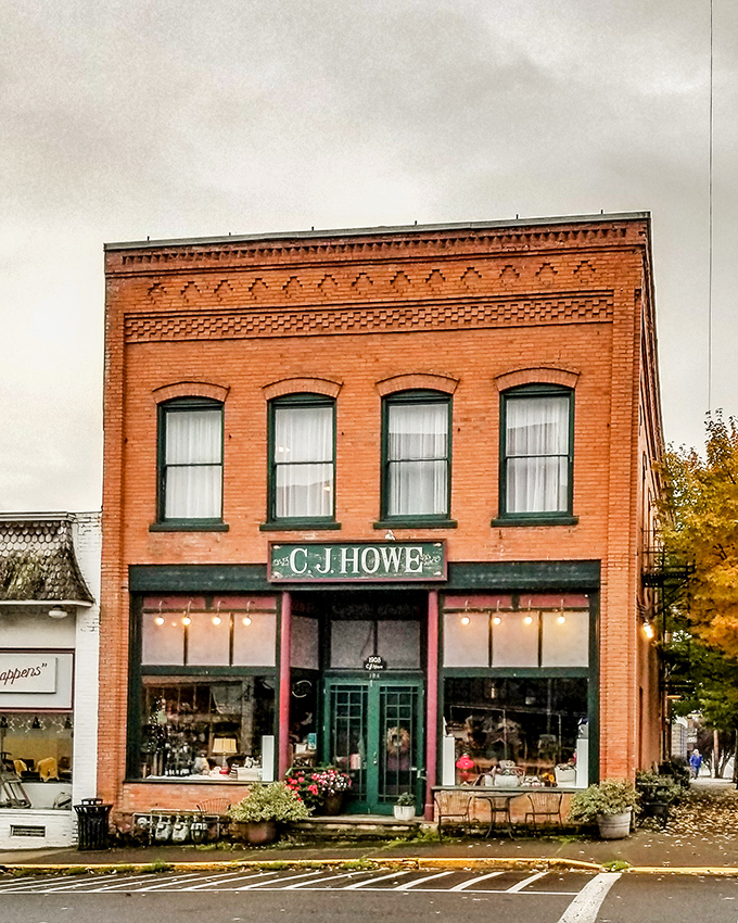 The C.J. Howe building stands as a testament to brick-and-mortar perfection, its windows displaying treasures both old and new to passing admirers.