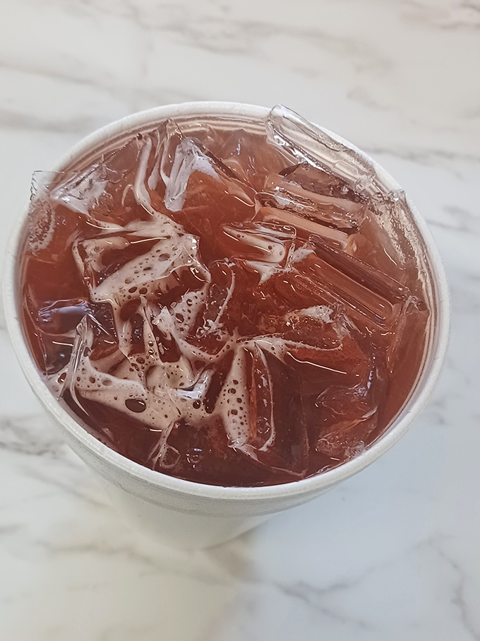 Another view of that sweet tea, catching the light like liquid amber—the unofficial wine pairing for everything on Tori's menu.