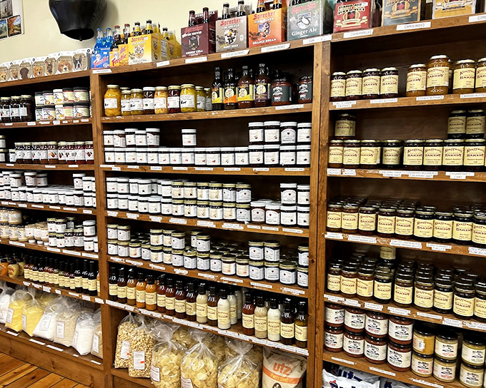 The jam wall—where fruit achieves immortality. These jars hold summer sunshine, ready to brighten even the grayest Ohio morning.