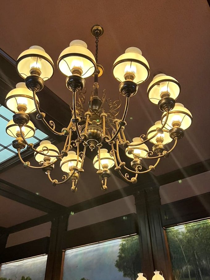 The chandelier doesn't just illuminate; it announces that you've arrived somewhere special – somewhere that understands the theater of dining.