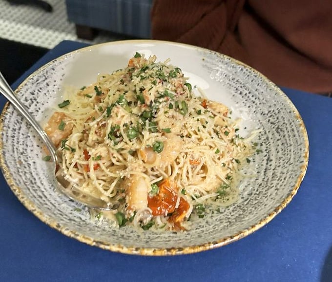 Pasta that's had a close encounter with the ocean – each twirl of noodles delivers seafood treasures that Captain Nemo would dive for.