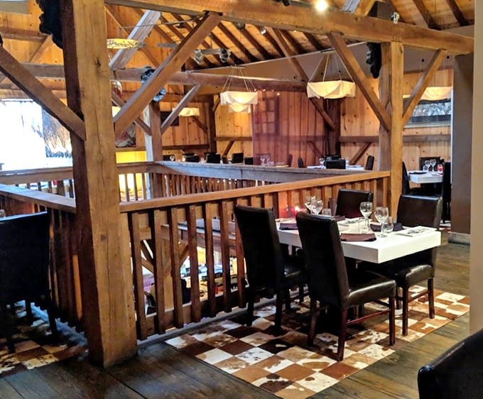 The multi-level dining space showcases original barn architecture—where each wooden beam could tell stories of harvests past and steaks present.
