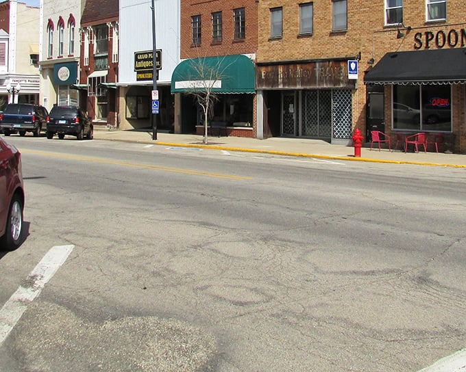 Those vintage storefronts aren't playing dress-up for tourists – they're the real deal, housing businesses that have weathered decades of economic storms.