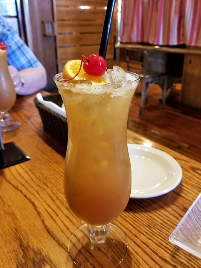This isn't just a cocktail—it's liquid sunshine in a glass, complete with the cherry on top that life sometimes forgets to provide.