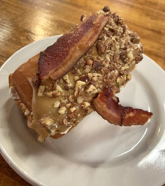 The maple pecan bacon long john—where breakfast and dessert collide in what might be the most beautiful accident in culinary history.