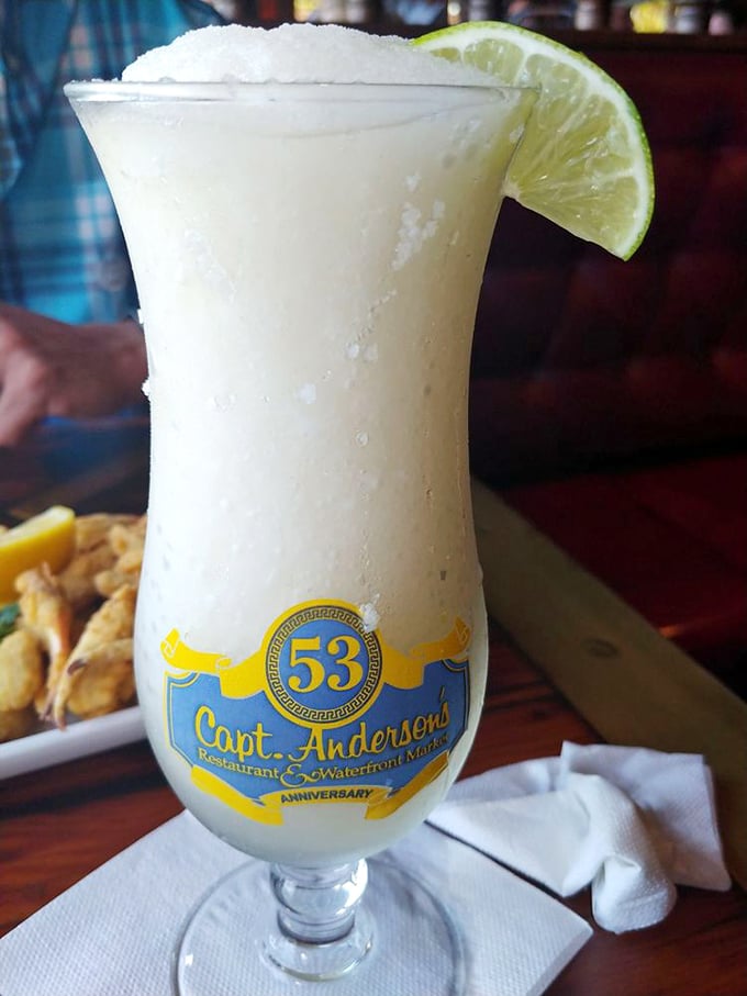 A frosty margarita in a commemorative glass—because sometimes the best souvenir isn't something you pack, but something you sip.
