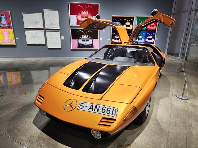 The Mercedes C111 with its gull-wing doors looks like it flew in from tomorrow. That orange paint job ensures you'll never lose it in a parking lot.