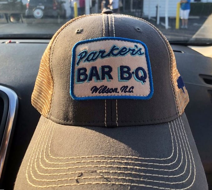 Wearing Parker's merch isn't just fashion—it's a declaration of barbecue allegiance. This hat says "I've made my Eastern-style choice, and I'm standing by it."
