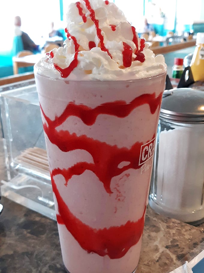 Milkshakes thick enough to require serious straw strength – served old-school style with the metal mixing cup on the side.