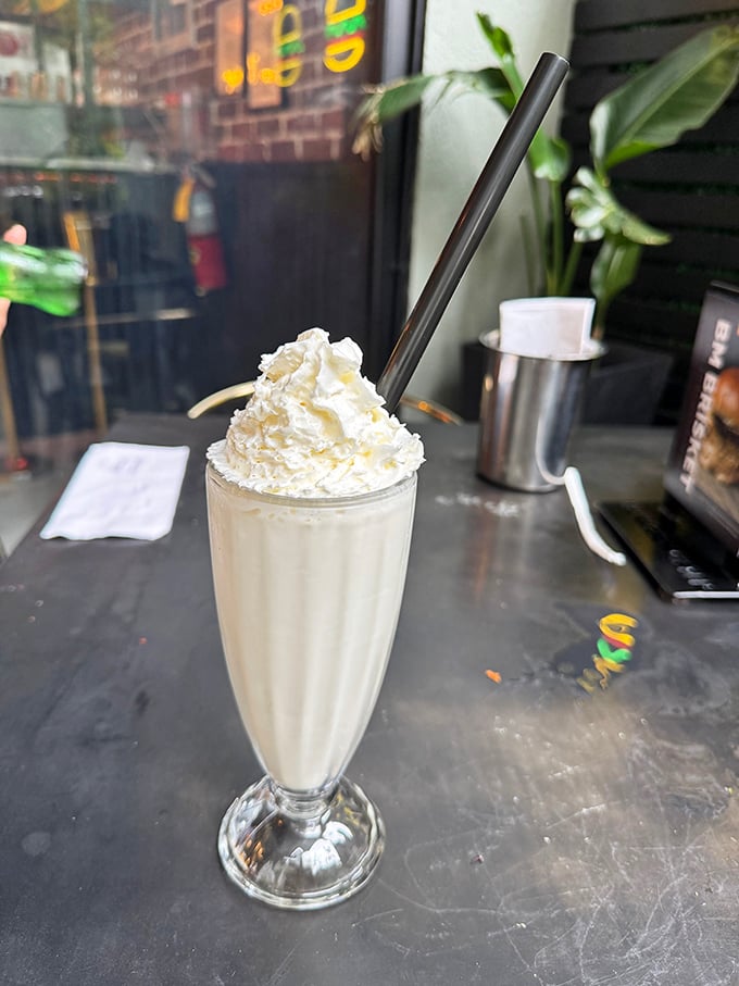 A vanilla milkshake so thick the straw stands at attention. This isn't a drink—it's dessert with aspirations.