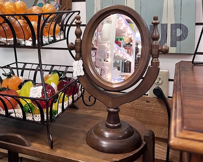 A vanity mirror reflects more than faces—it captures glimpses of history amid colorful glass fruit that never spoils and always delights.