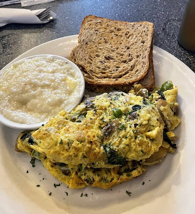 This isn't just an omelet – it's a masterclass in egg architecture, where vegetables and cheese find their higher purpose.