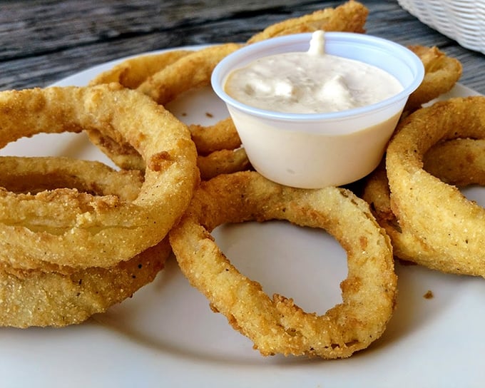 Onion rings aren't just appetizers here – they're golden halos of happiness. Crispy, light, and begging for that dipping sauce.