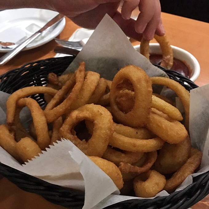 Onion rings stacked like delicious golden halos. If angels ate bar food, this basket would be their go-to order.