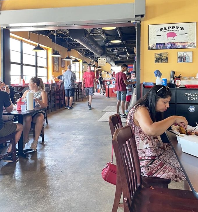 The dining room buzzes with the universal language of BBQ appreciation—nodding heads, closed eyes, and the occasional "mmm" escaping between bites.