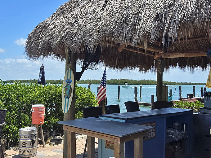Tiki hut paradise where boats drift by, cold drinks flow freely, and Monday morning meetings feel like they're happening in another dimension.