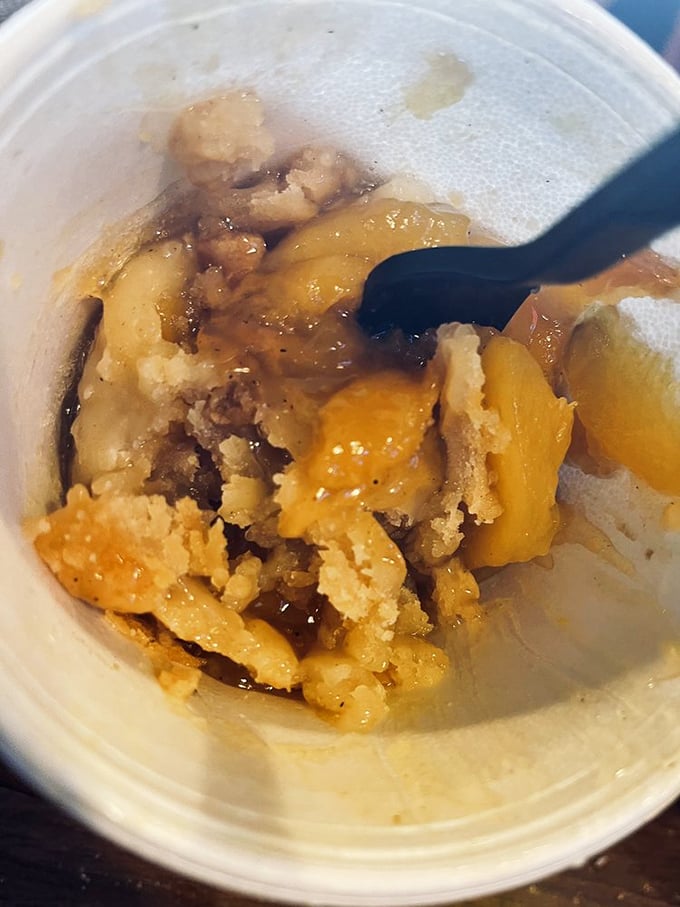 Peach cobbler that doesn't need to show off—just honest fruit, honest crust, and the honest truth that you'll be ordering seconds.