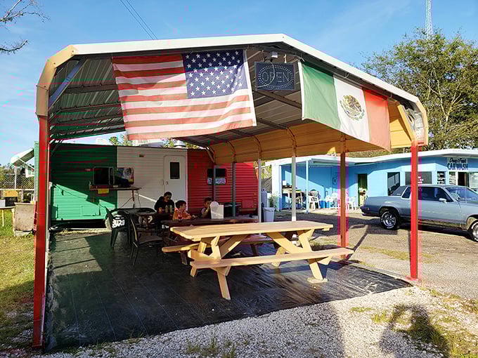 This colorful outdoor dining spot flies multiple flags, celebrating the international language we all understand – good food shared outdoors.