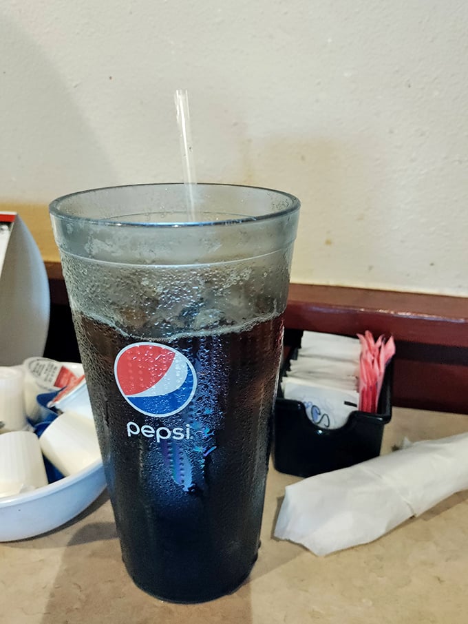 That condensation on the Pepsi glass isn't just moisture – it's the visual soundtrack to Florida's heat and the promise of sweet, cold relief.