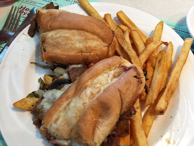 A sandwich that requires both hands and possibly a strategic game plan. The fries are just there to provide moral support.
