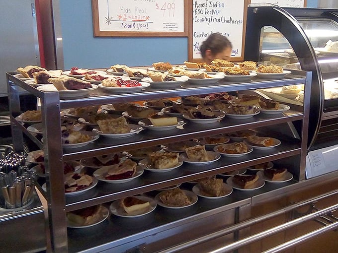 The pie display—where dreams are stacked three shelves high and calories don't count if you're on vacation.