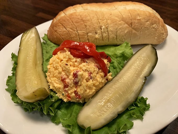 Pimento cheese sandwich with pickle spears longer than your Monday meetings. Southern comfort on a plate.