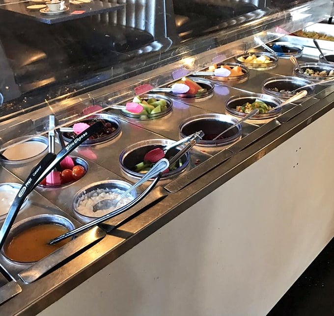 The salad bar—mission control for healthy options. Each compartment offers fresh ingredients for creating your own edible galaxy.
